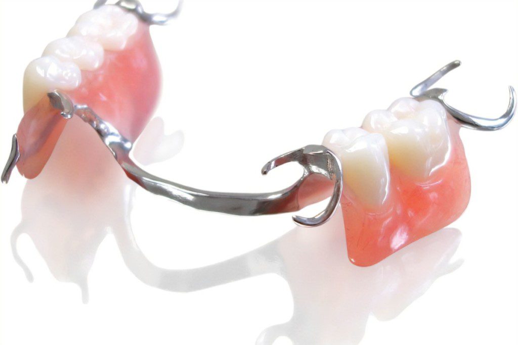 The Trouble with Dentures and Partials: The Solution